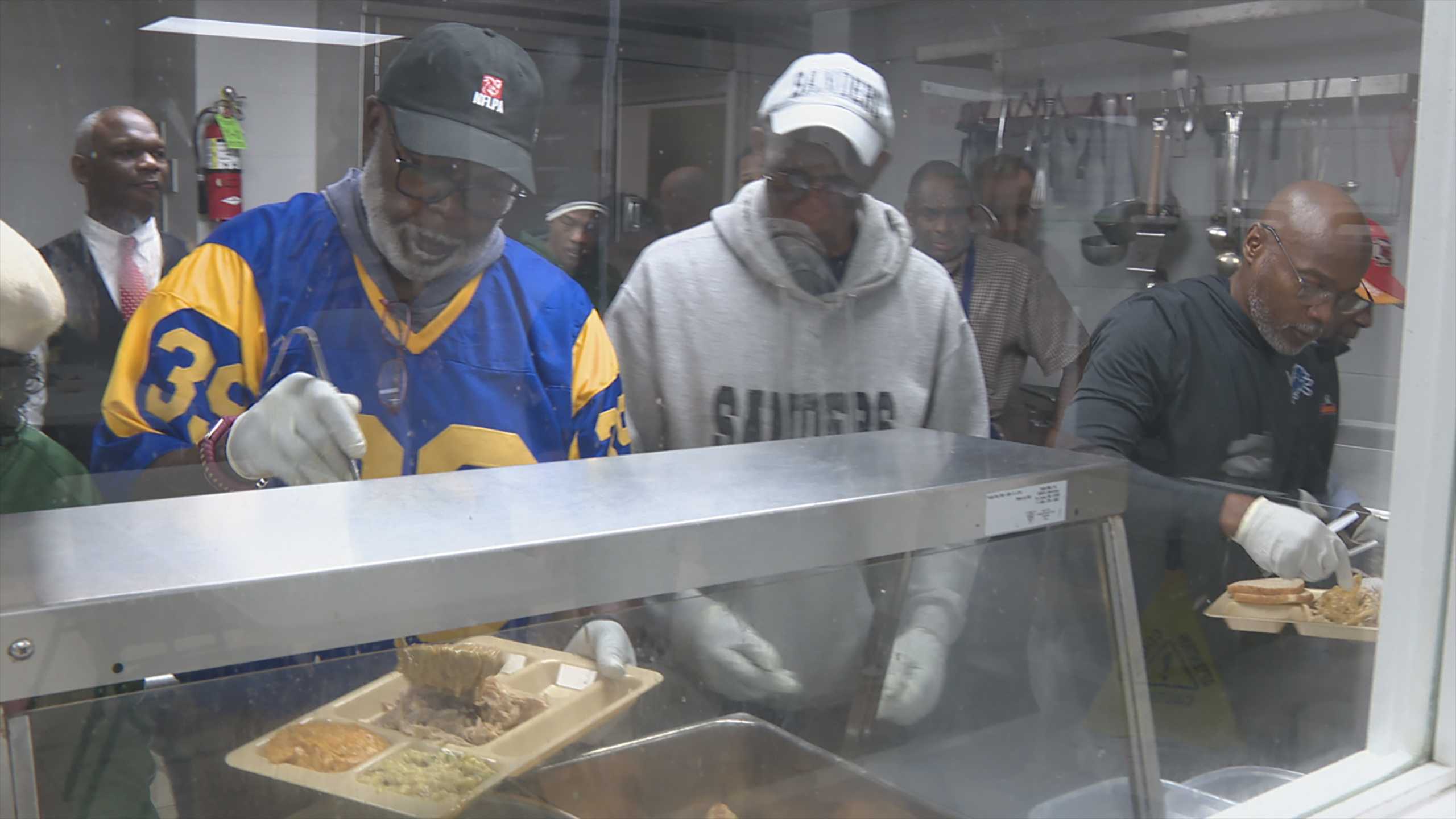 Retired NFL players serve lunch to homeless people in Jackson
