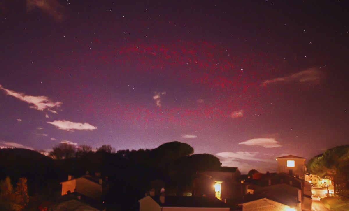 Photographer Snaps Rare Red Halo Above the Italian Alps—See the Photo!