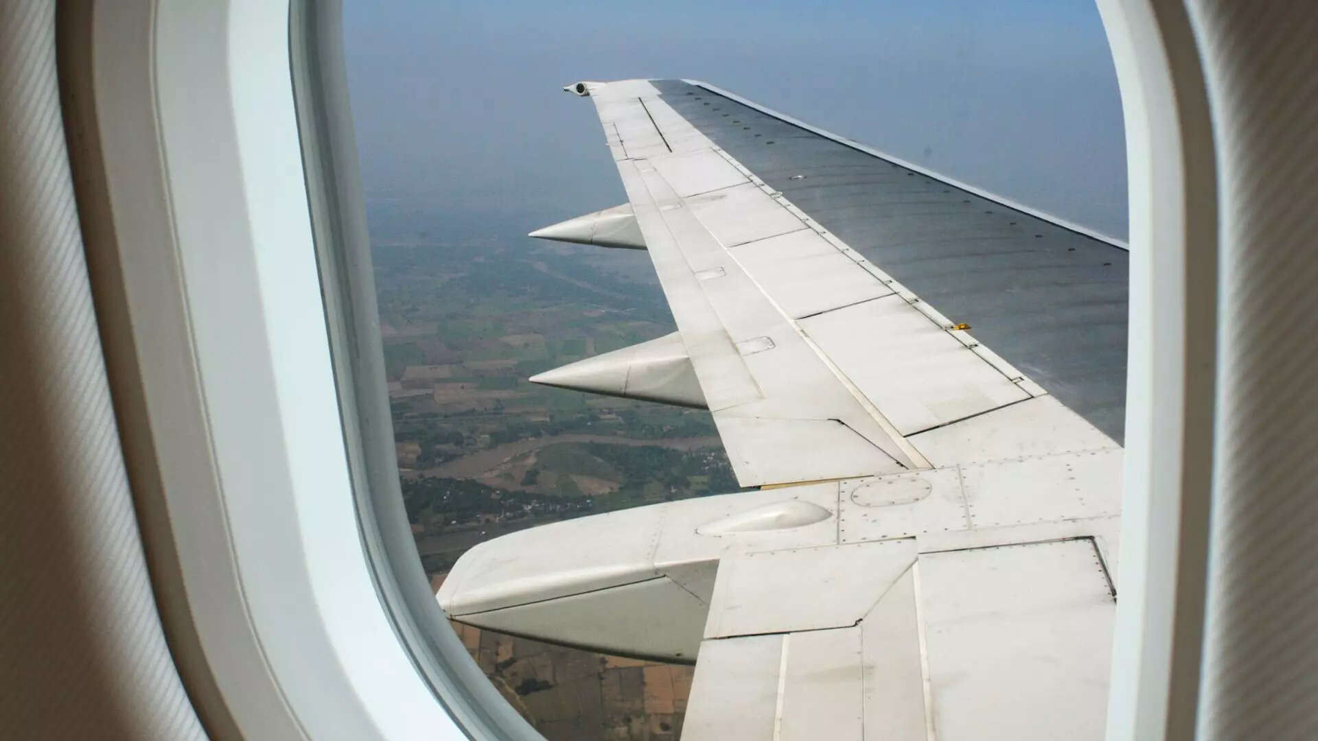 Why airplane windows have a tiny hole