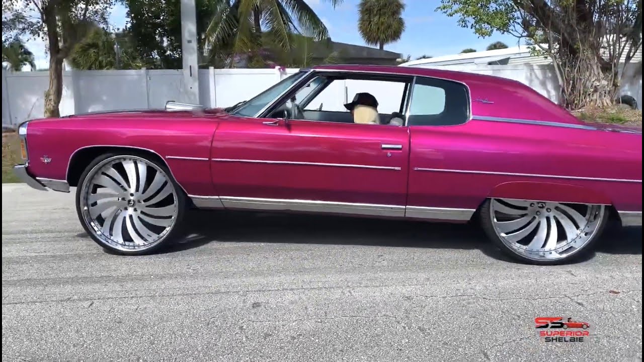 Magenta paint 71 Chevy Impala donk on 28” Forgiatos