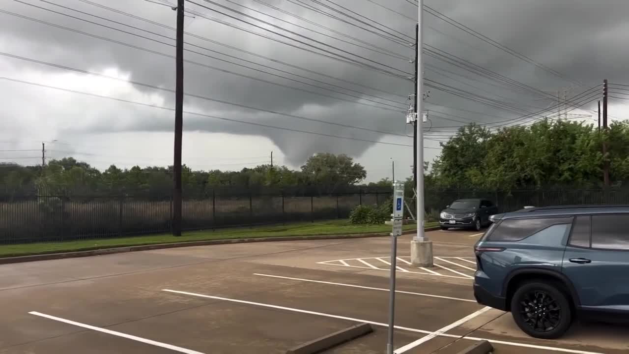 Tornado forms behind fire station in Houston, Texas
