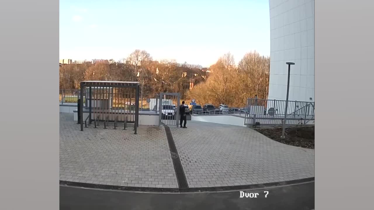 Van going up slope on rear wheels smashes gate and sends man flying