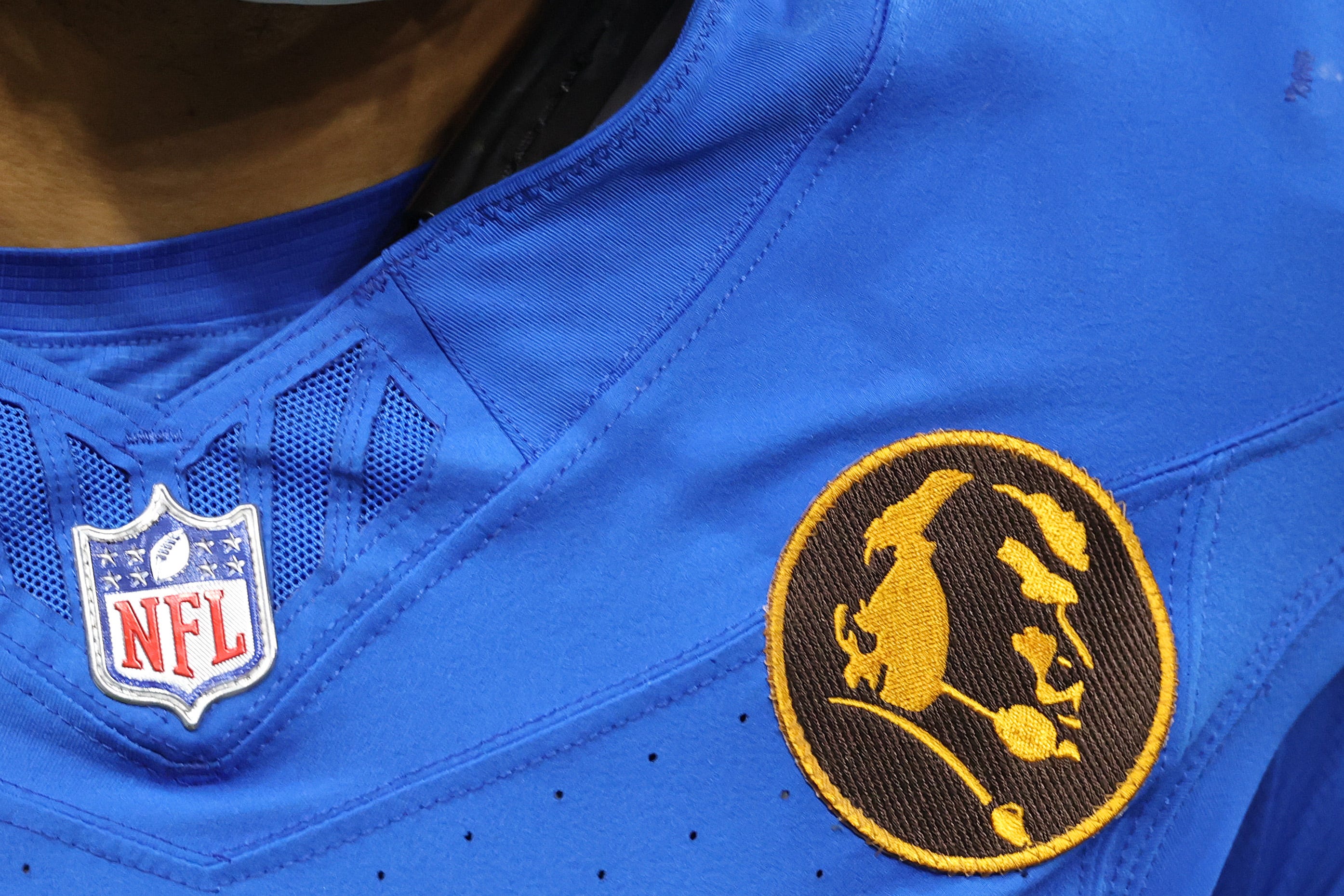 What are the John Madden patches on NFL Thanksgiving team uniforms?