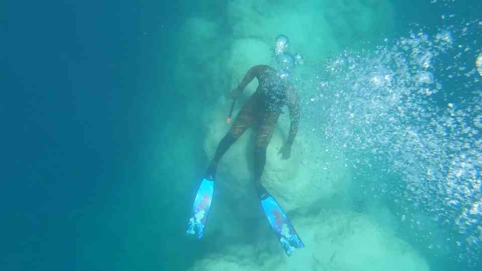 Cliff Jumping Into the Ocean and Snorkeling Crystal Clear Reef Waters