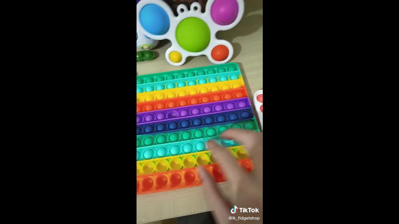Playing Rainbow Heart Shaped Pop It