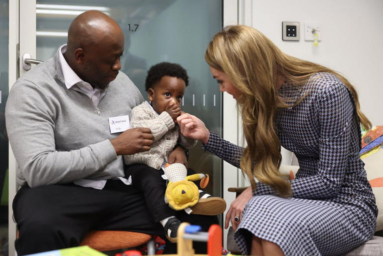 Baby hangs onto Princess Kate's finger in heartwarming moment