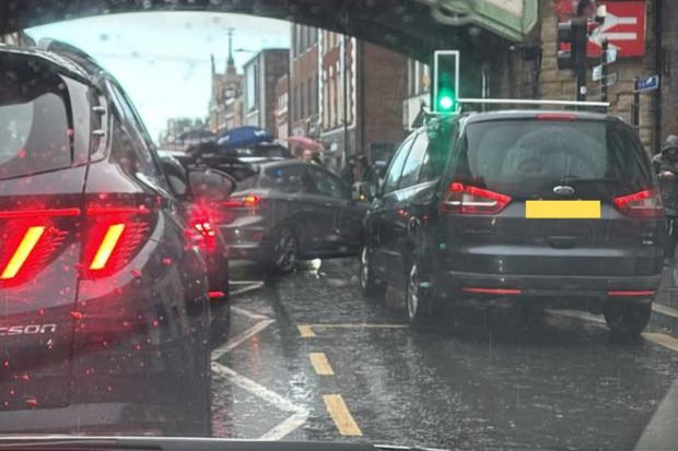Pedestrian hit by car at city centre crossing