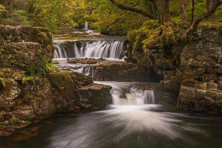 The tiny Welsh village surrounded by waterfalls and cosy pubs that only ...