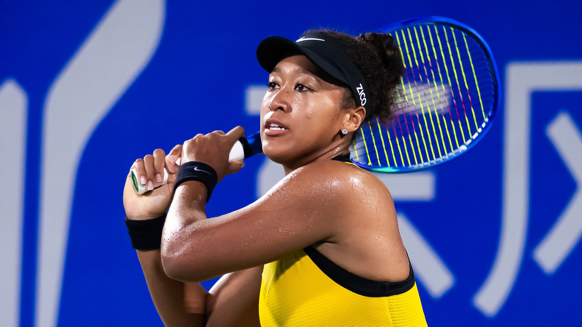 Naomi Osaka stuns in tiny backless mini dress and flower detail heels