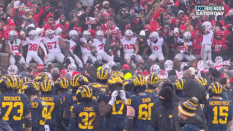 Michigan Players Guard the ‘M’ Logo at Midfield After Ohio State’s ...