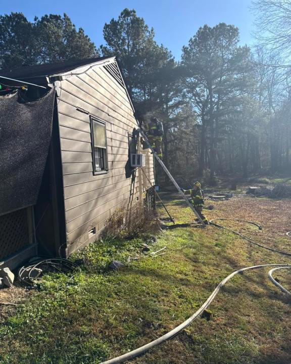Three people displaced after wood stove sparks house fire