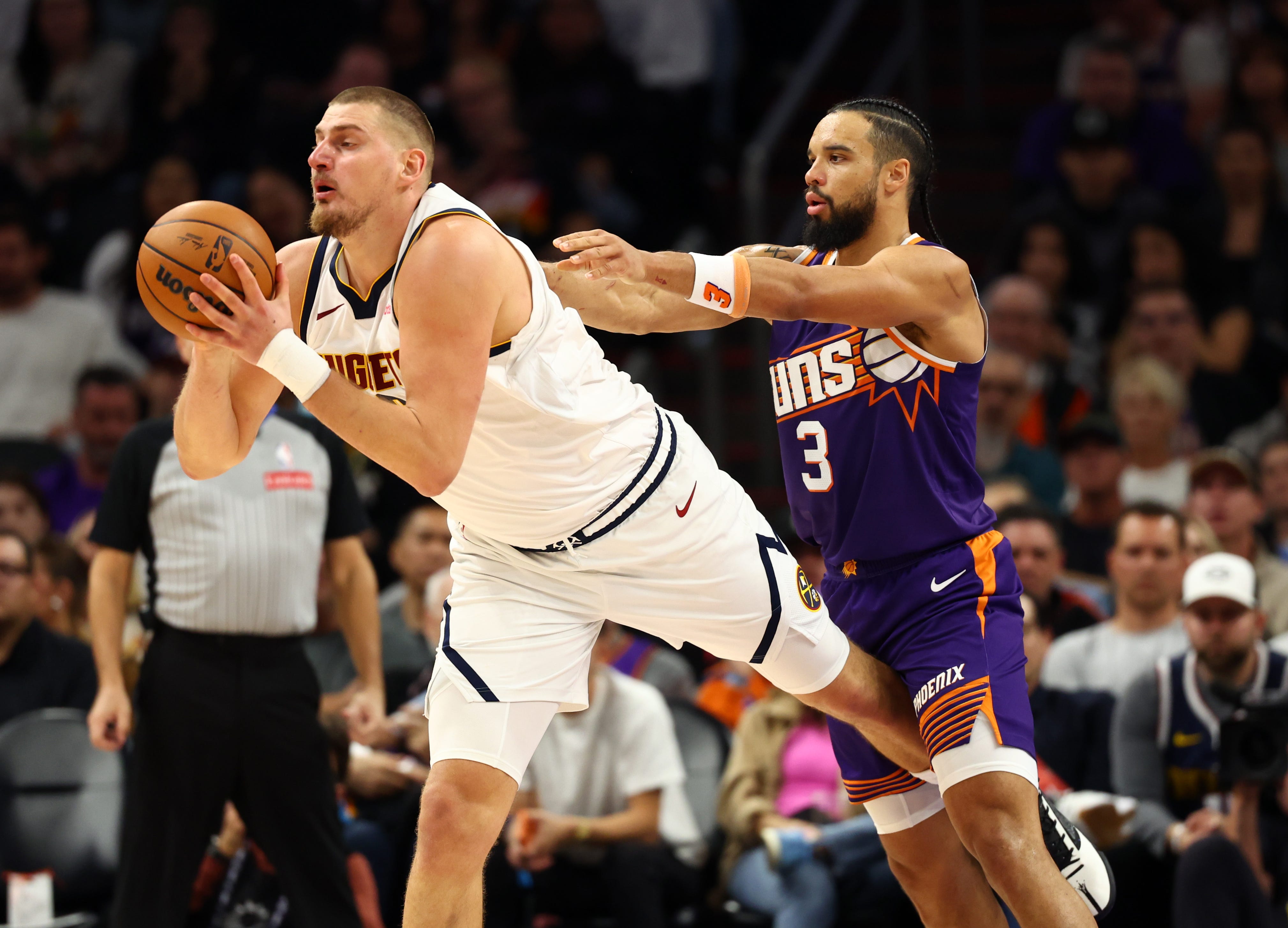 Nikola Jokic perfect, leads Nuggets past Suns with near triple double
