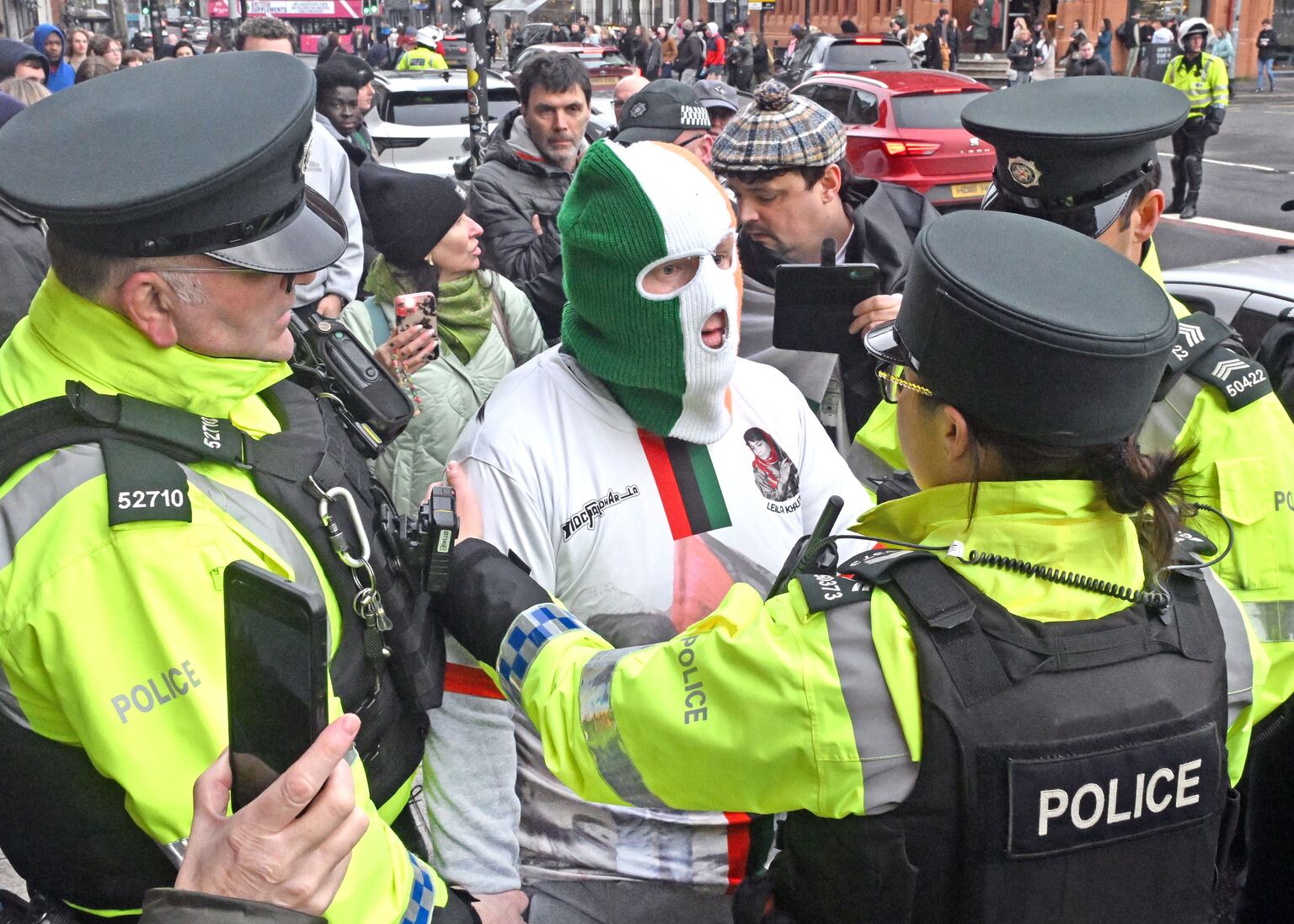 Man in tricolour balaclava arrested as pro-Palestine and loyalist ...