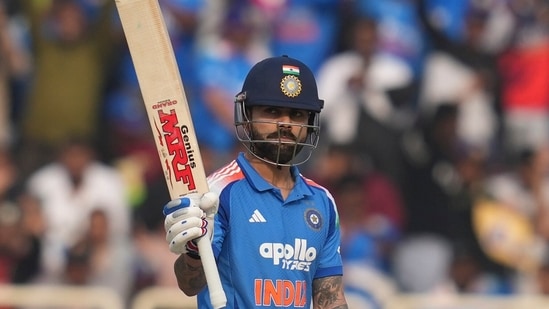 Virat Kohli looks to the sky with folded hands after completing 52nd ...
