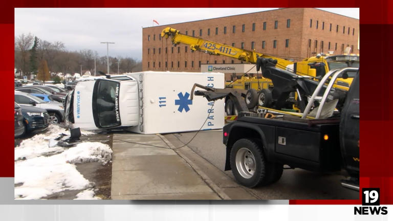 Ambulance crashes, flips outside Marymount Hospital