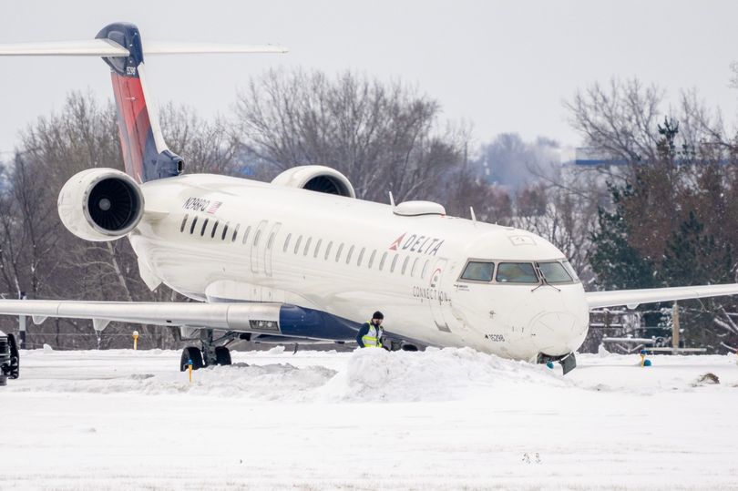 Delta plane skids off icy Iowa runway as winter chaos knocks out power ...
