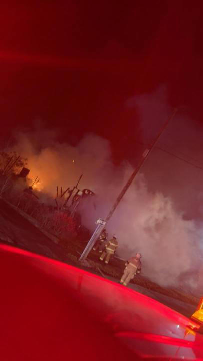 Firefighters race to stop Clay house fire from spreading to nearby post ...