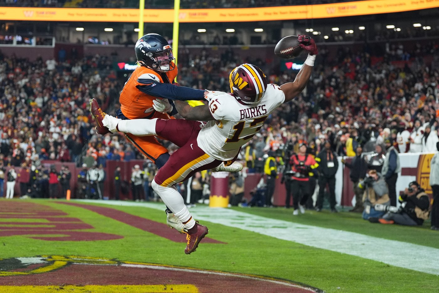 Catch of the year? Commanders' Treylon Burks makes incredible 1-handed TD grab vs. Broncos