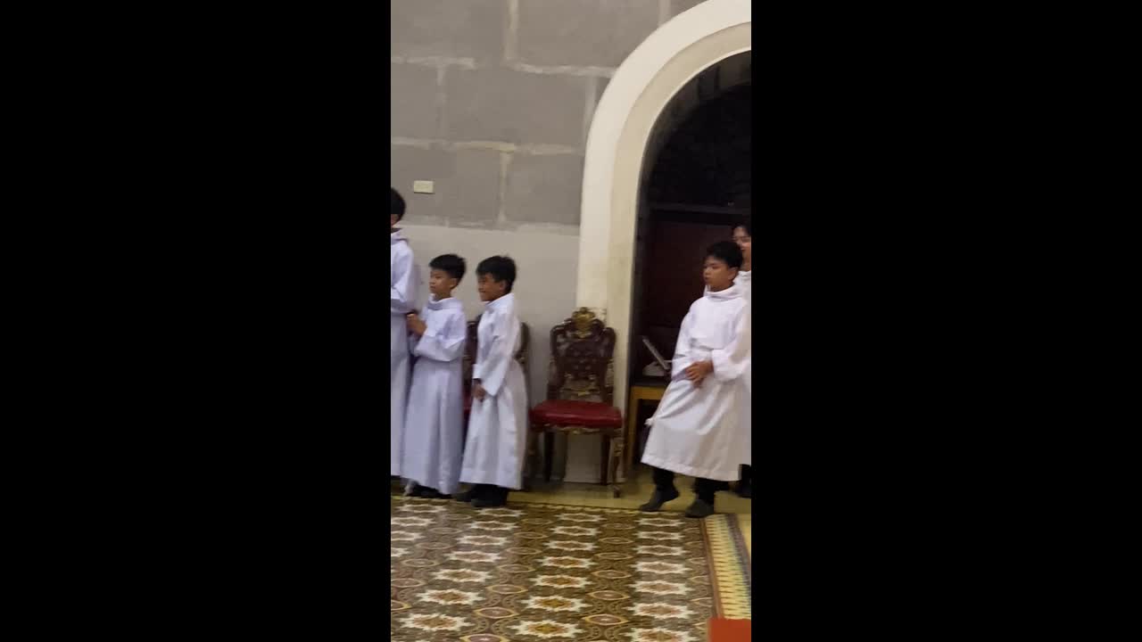 Wholesome choir boys cheer as bride and groom have first kiss