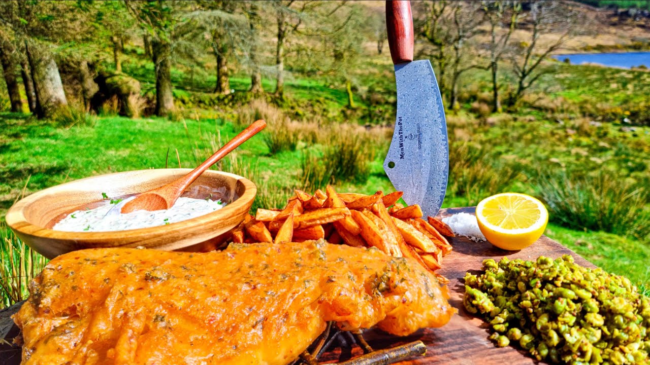 Crispy French fries with battered fish cooked in the wilderness