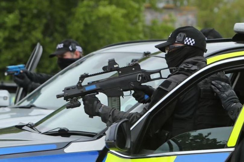 Armed police and 'panicked' students amid reports of group with weapons ...