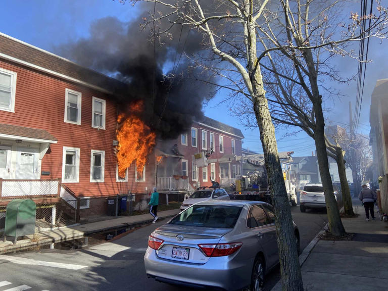 Utility worker credited with rescuing resident from burning row home