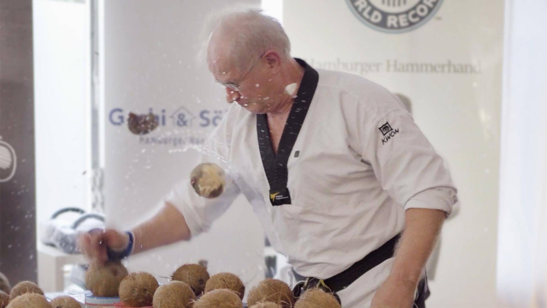 Most coconuts smashed with one hand in one minute 125 by Kahrimanovic ...