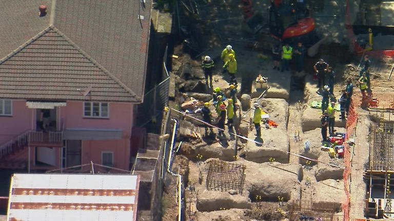 Man dies, colleagues save teen's life after Brisbane wall collapse
