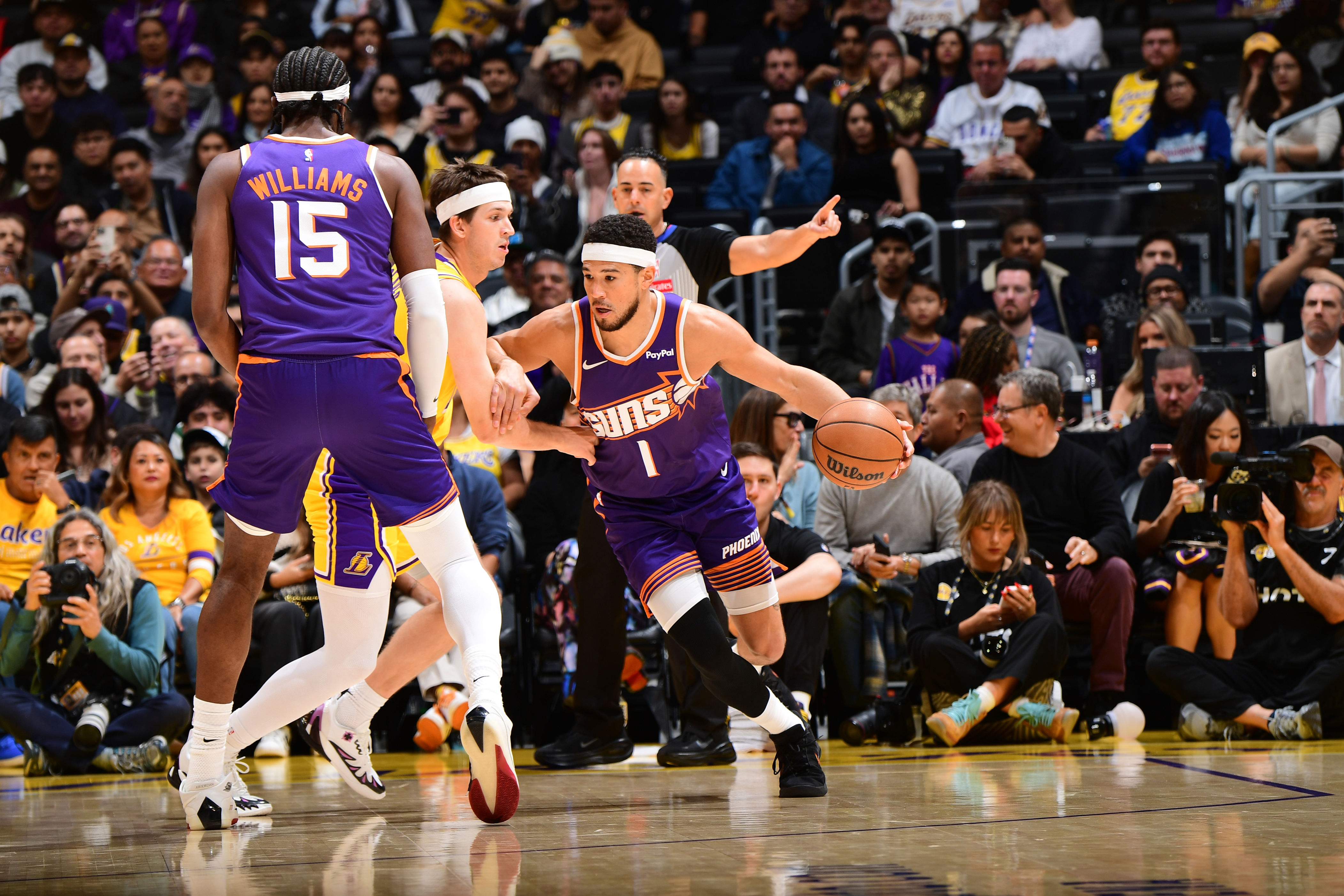 Devin Booker departs with apparent groin injury