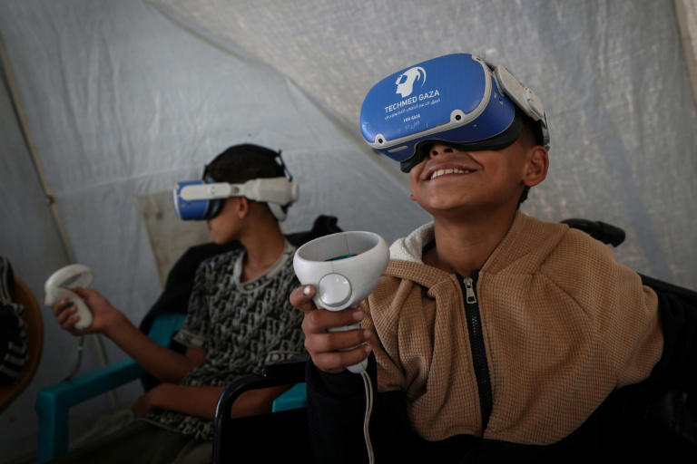 VR headsets take war-scarred children to world away from Gaza