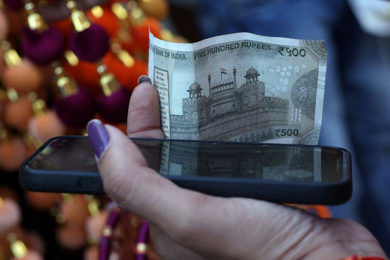 Rupee hits record low on feeble foreign flows, drawing RBI to defend 90 ...