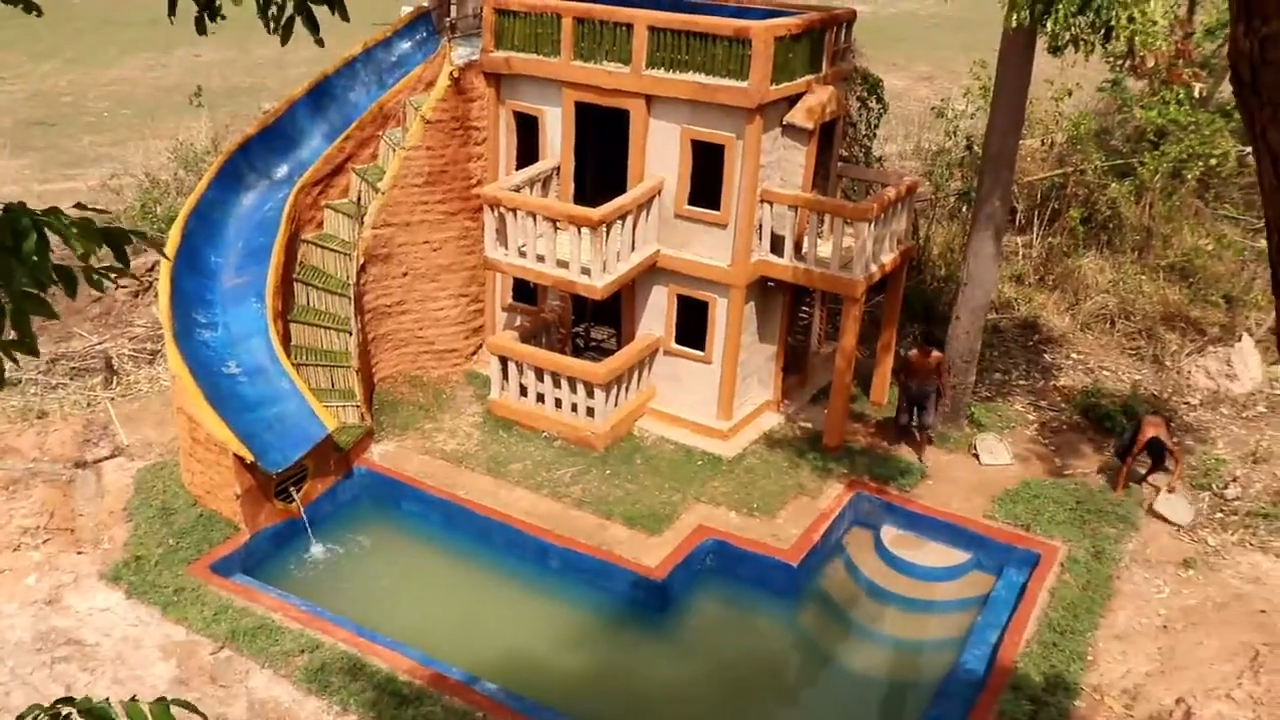 A $0 hand built three story home and underground pool with water slide ...