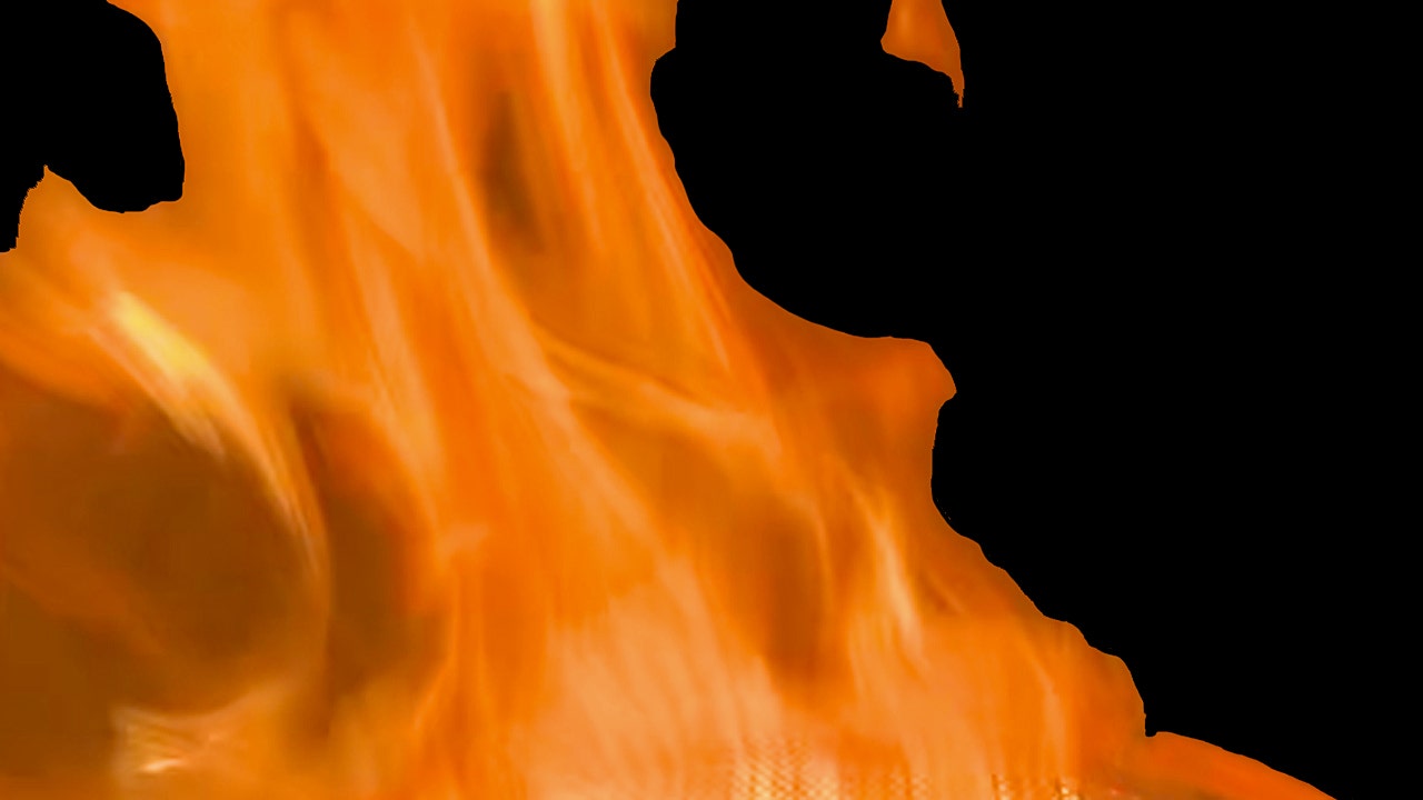 Loganville police officer pulls man through window of burning home