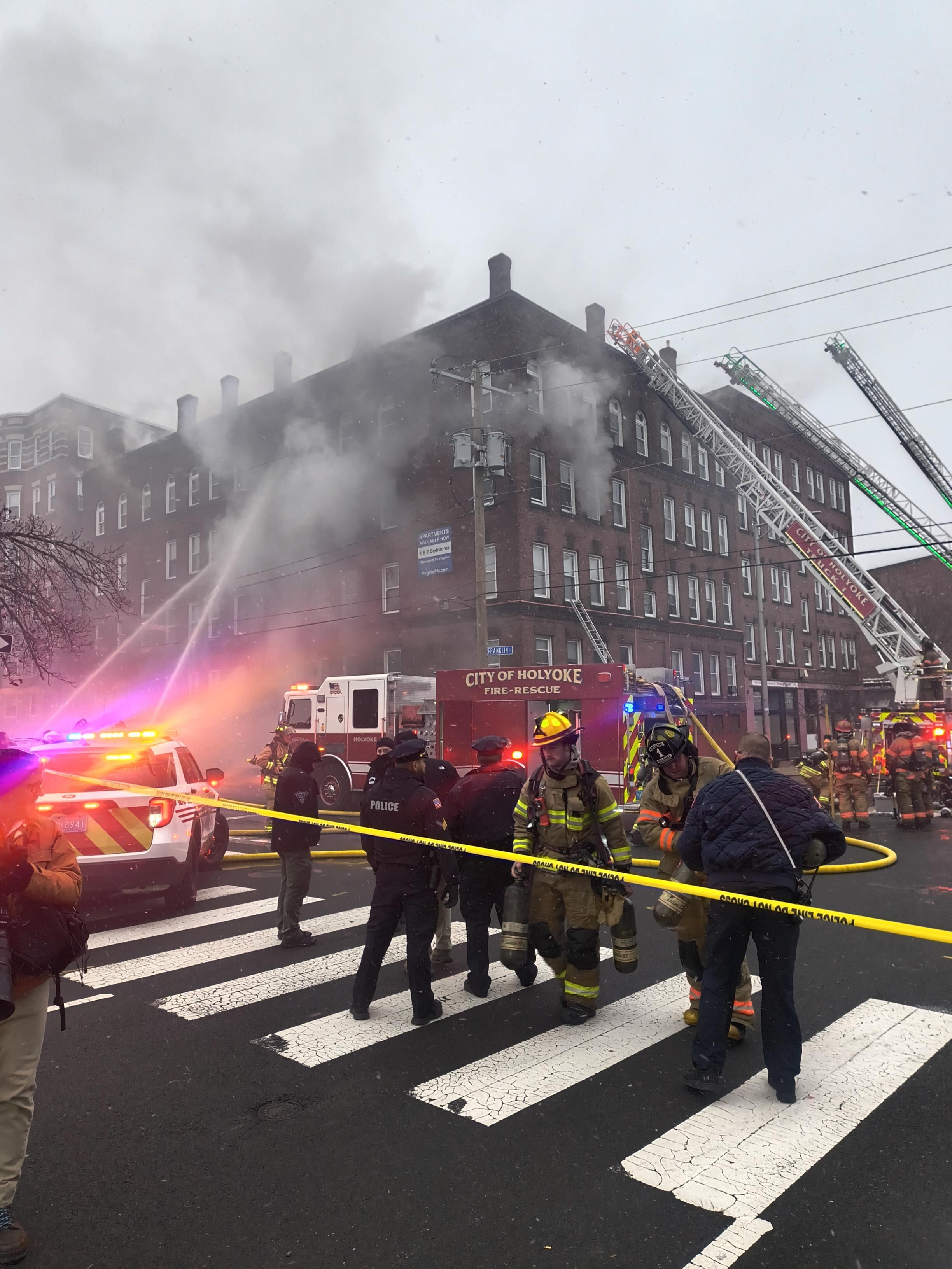 Crews battle Holyoke apartment building fire