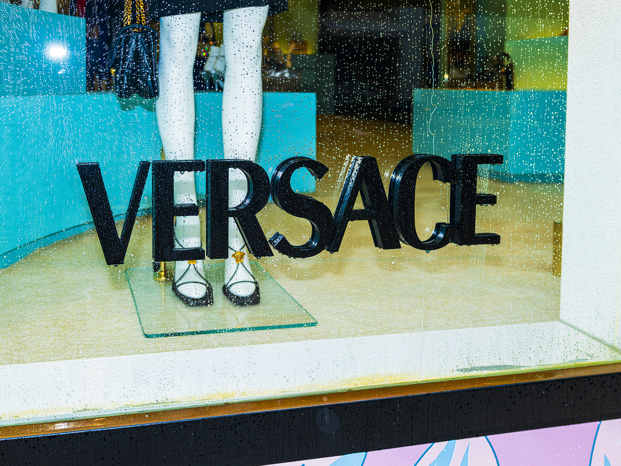 Prada completes purchase of Versace, its longtime rival