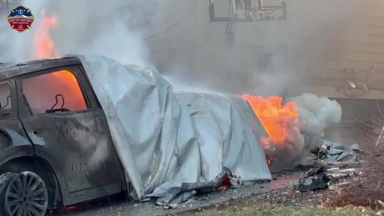 WATCH: Electric car catches fire inside Douglas County garage