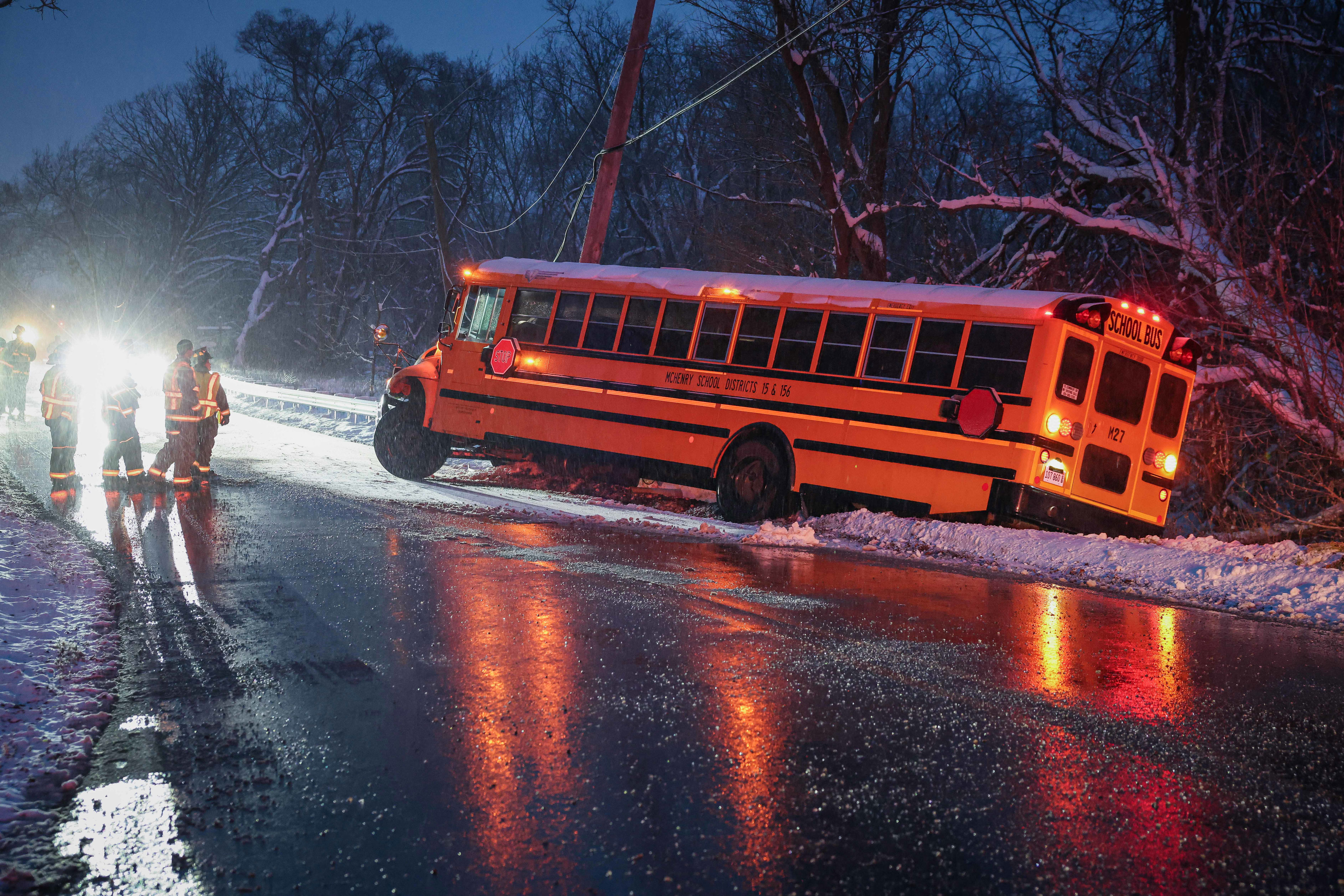 Suburban school bus crash on snowy road downs power lines, leaves 1 ...