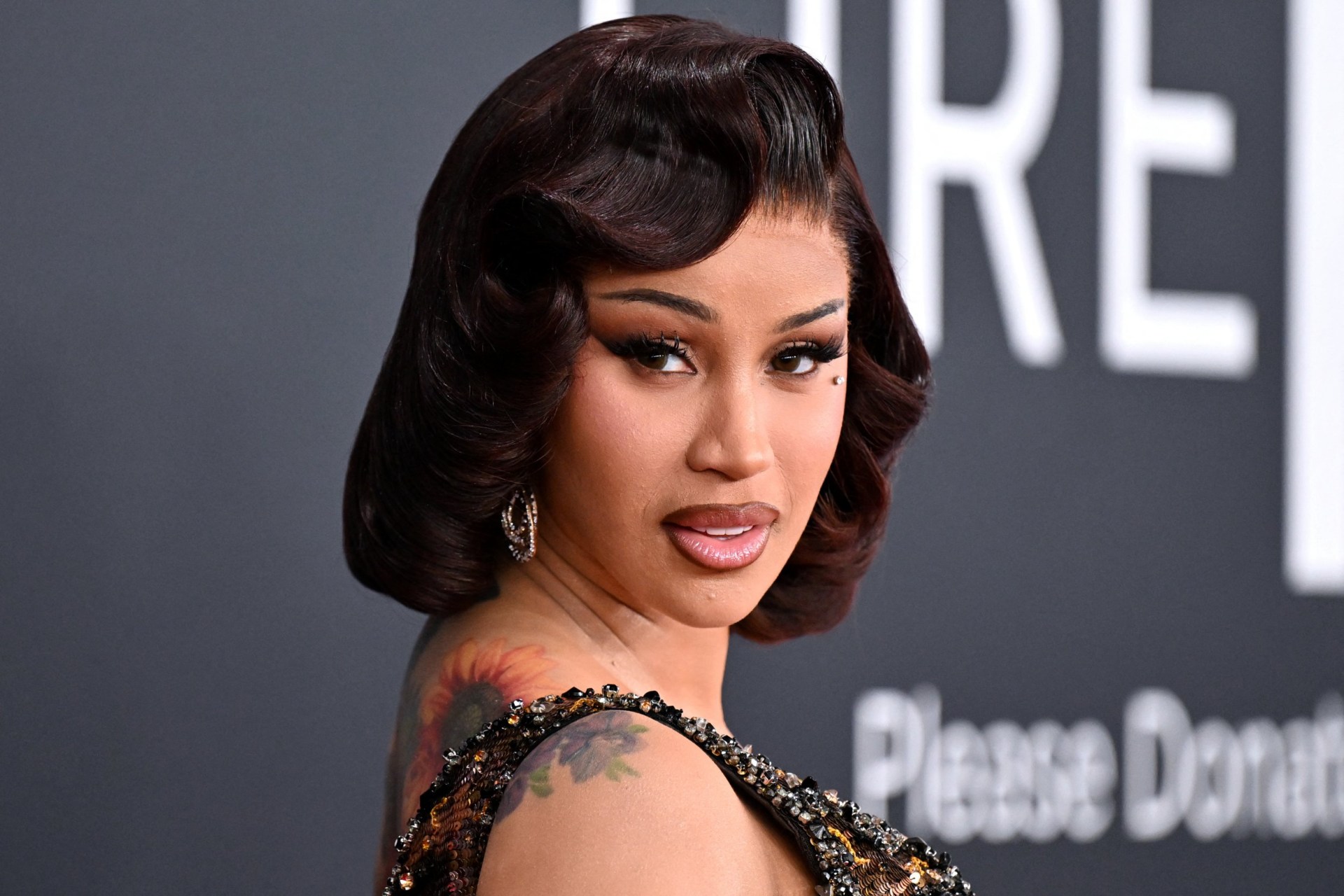 Cardi B unveils dazzling neck piercings in bold move