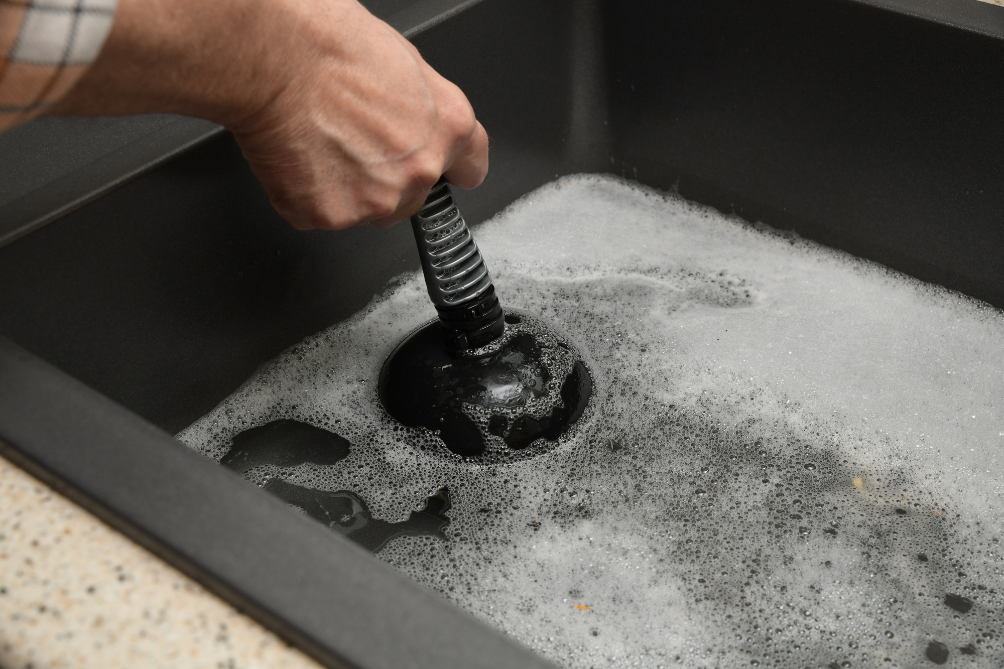Methods to unclog drains without chemicals