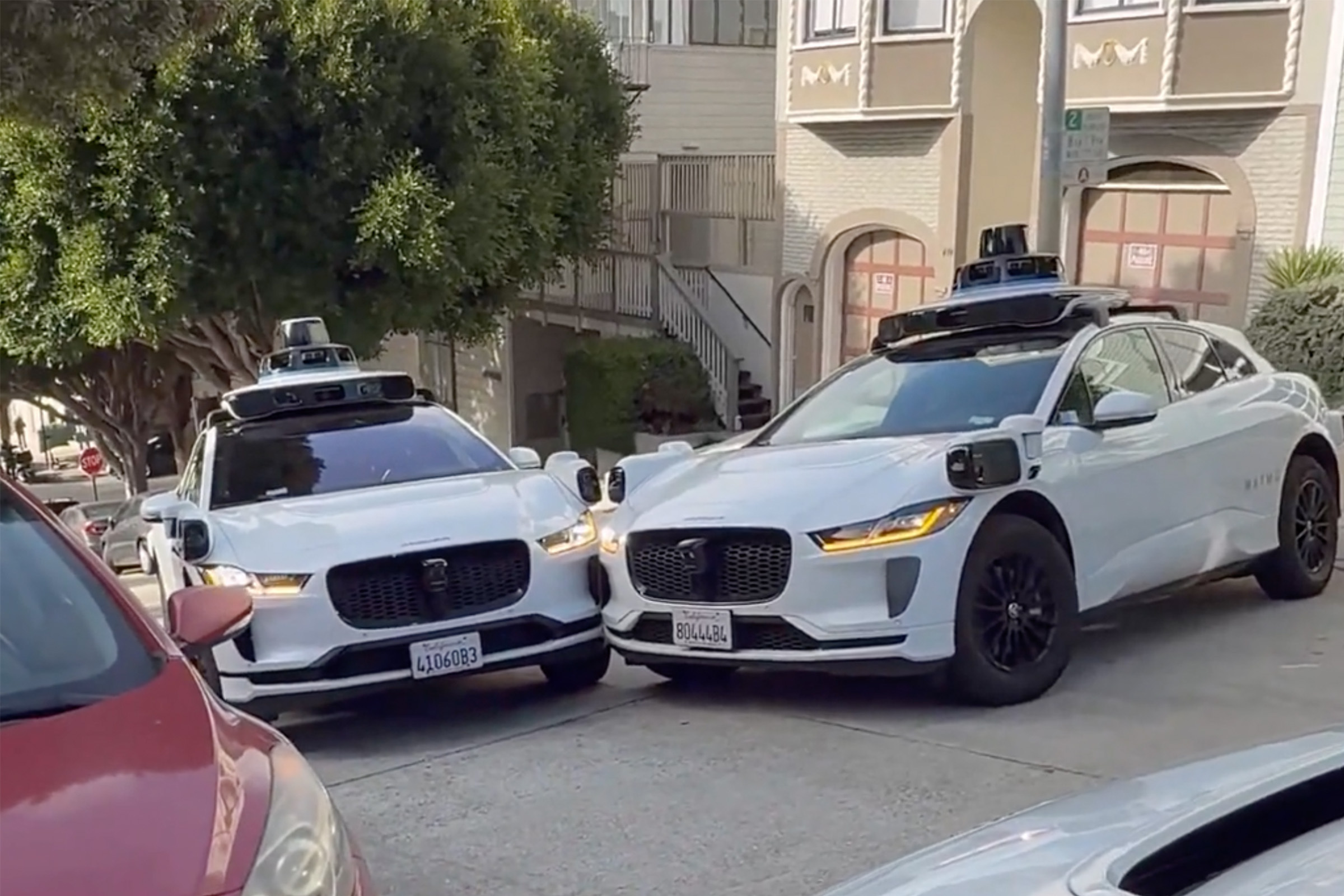 Two self-driving Waymos just crashed into each other, trapping a third ...