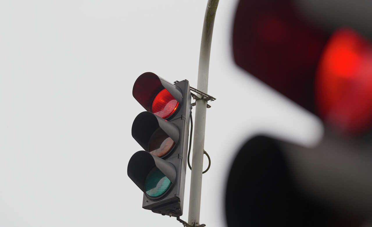 Police: Driver dies after running red light, causing crash