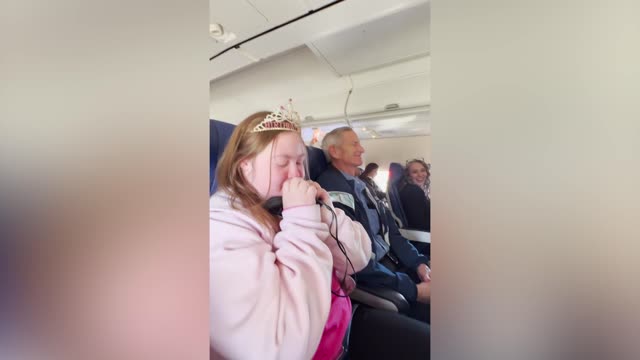 Plane passengers celebrate a woman's birthday by singing to her with ...