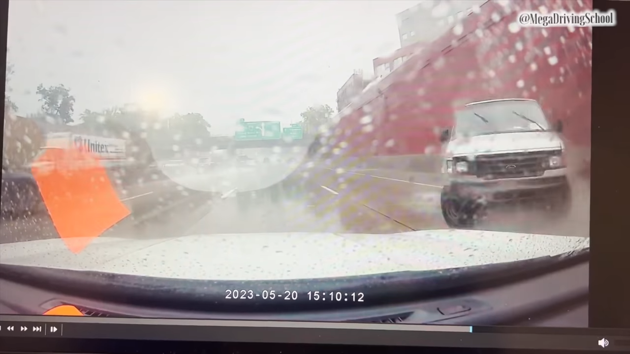 Driver battles for control as van skids across wet highway