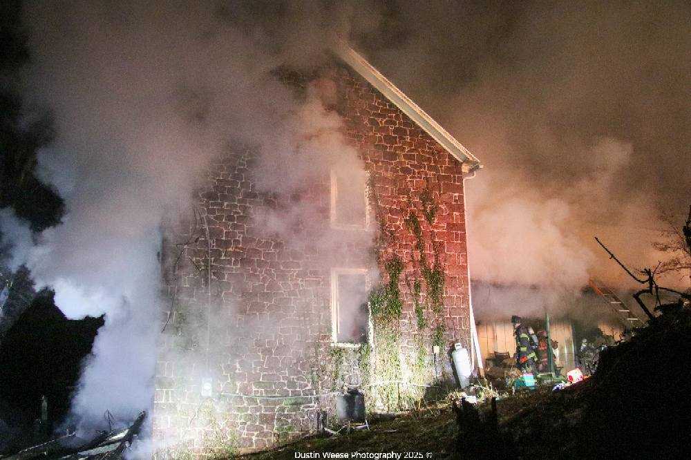 Flames shoot from burning home in two-alarm fire