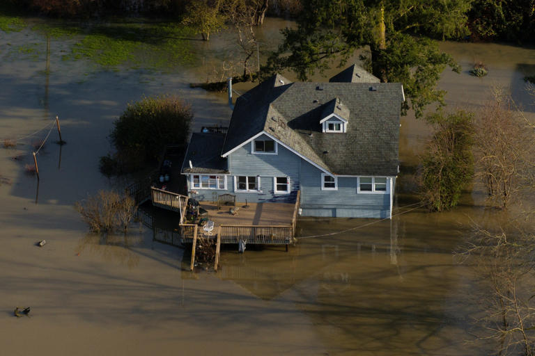 Photos show atmospheric river bringing flooding to Pacific Northwest