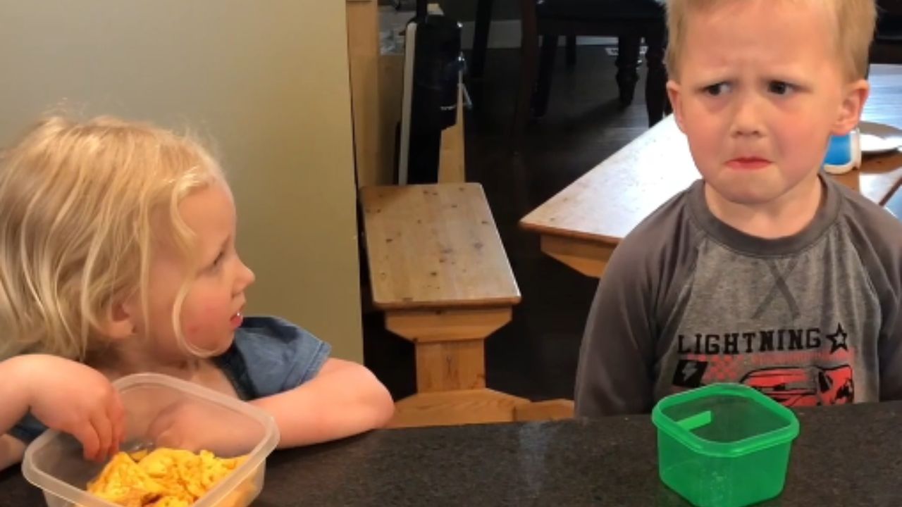 Little girl shares her meal with her brother in the 'sharing challenge'