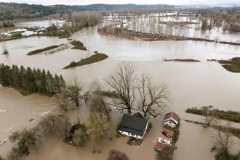 Photos show atmospheric river bringing flooding to Pacific Northwest