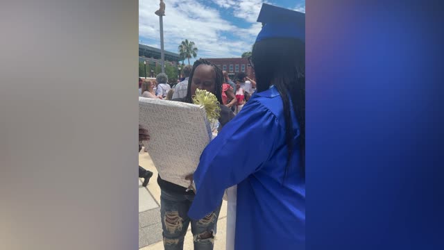 Children express gratitude to their mother with diplomas at graduation ...