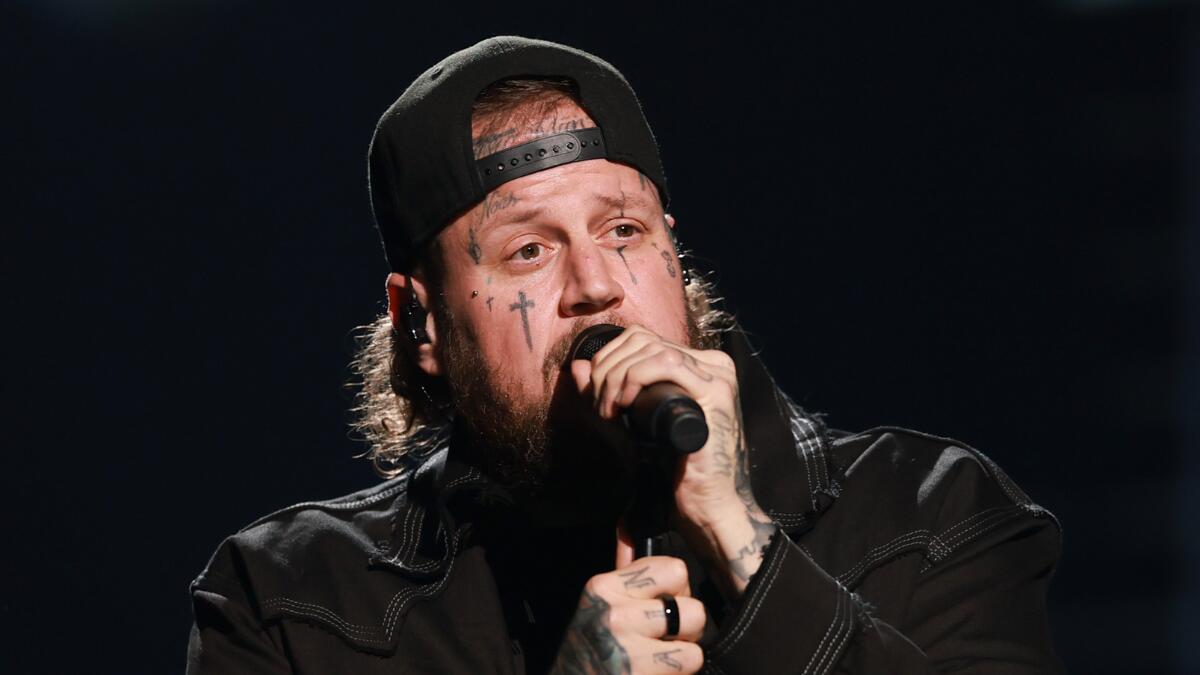 Jelly Roll tearfully reacts to surprise from country star Craig Morgan