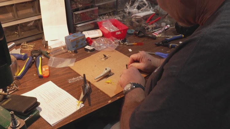 Small business owner says 1,000 packages stuck at post office